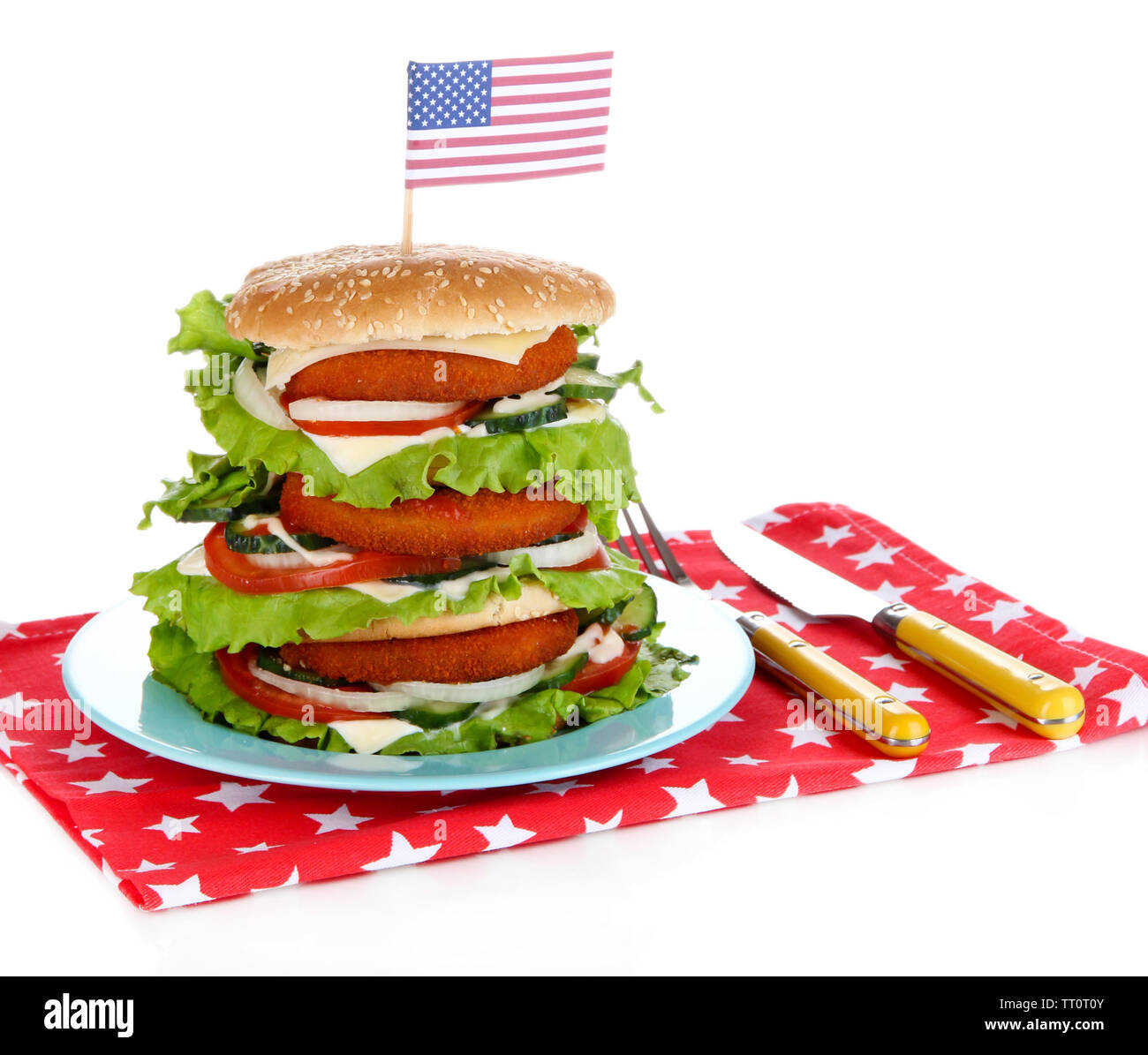 Composition with huge burger on color plate and USA flag, isolated on ...