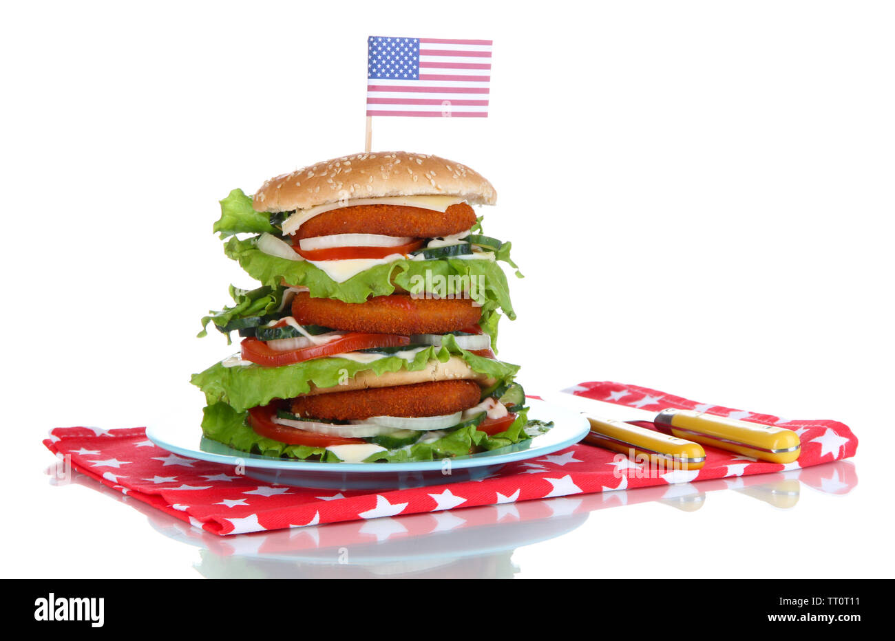 Composition with huge burger on color plate and USA flag, isolated on ...