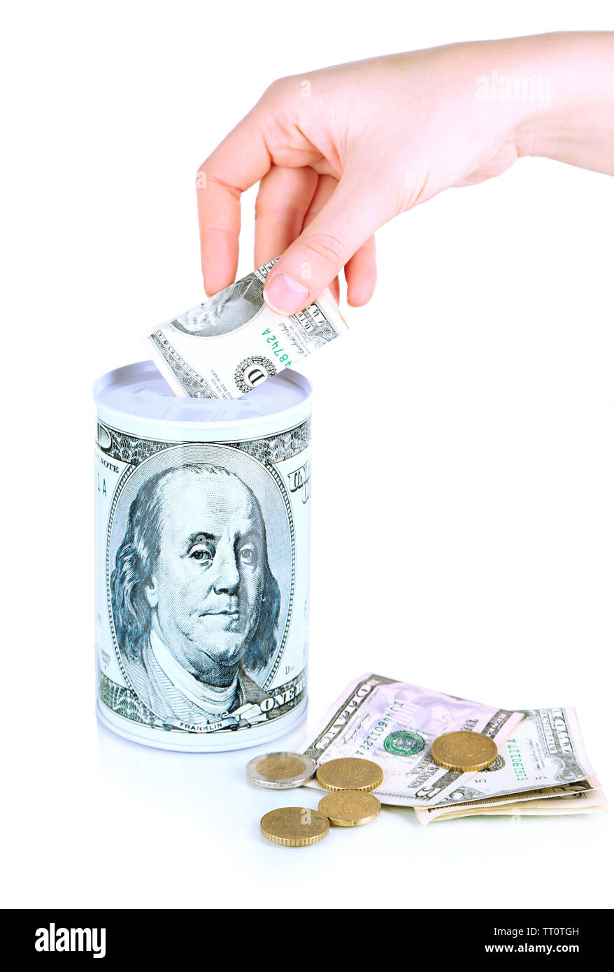 Female hand putting money in moneybox isolated on white Stock Photo - Alamy