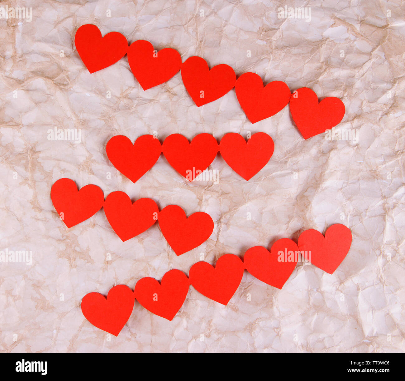 Paper hearts on paper background Stock Photo - Alamy