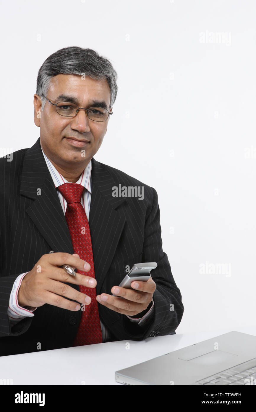 Mobile older indian hi-res stock photography and images - Alamy