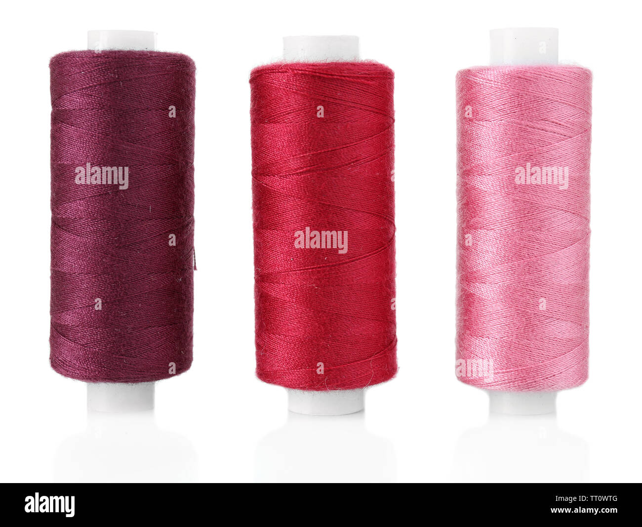 Colored spools of threads isolated on white Stock Photo - Alamy