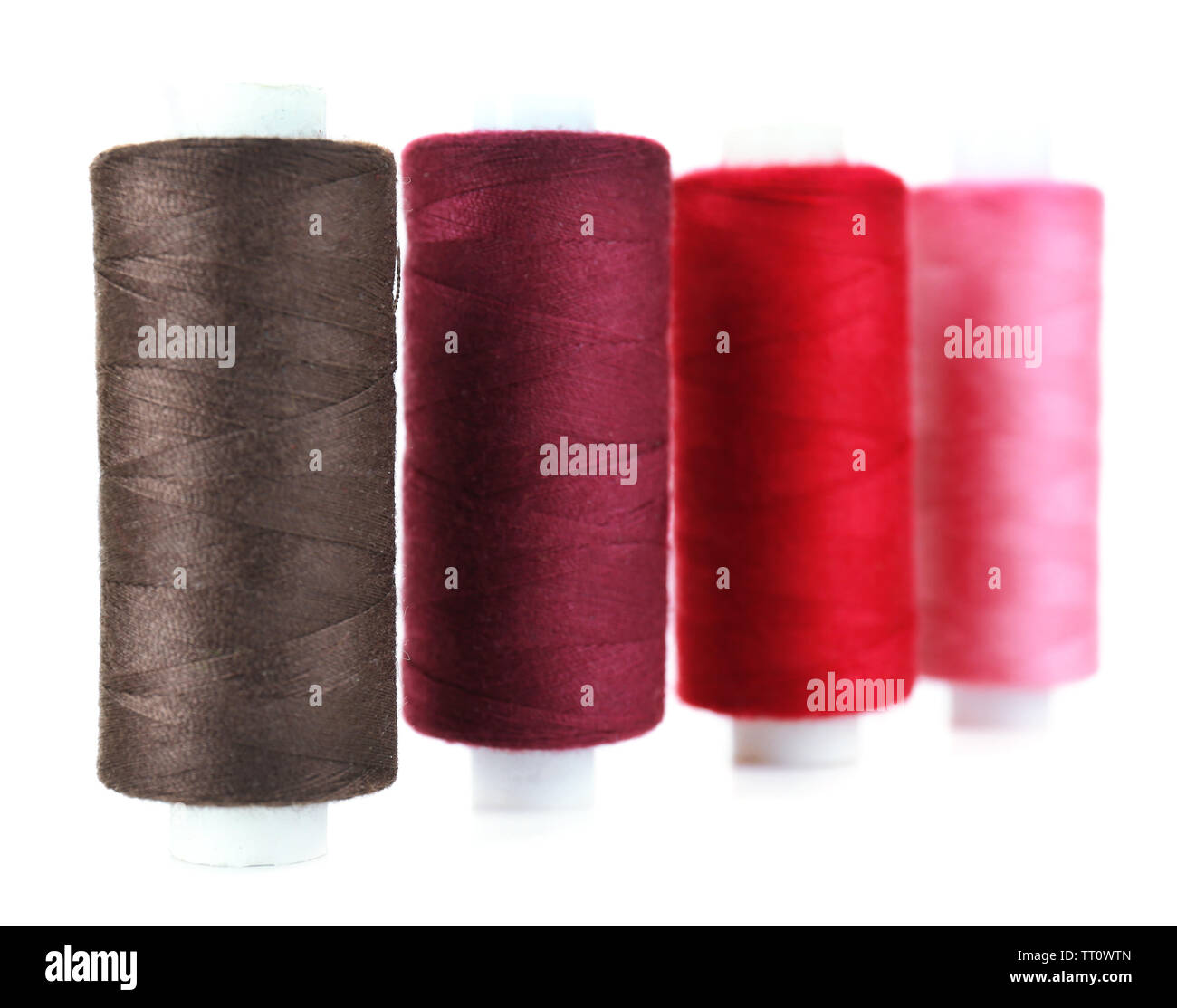 Colored spools of threads isolated on white Stock Photo - Alamy
