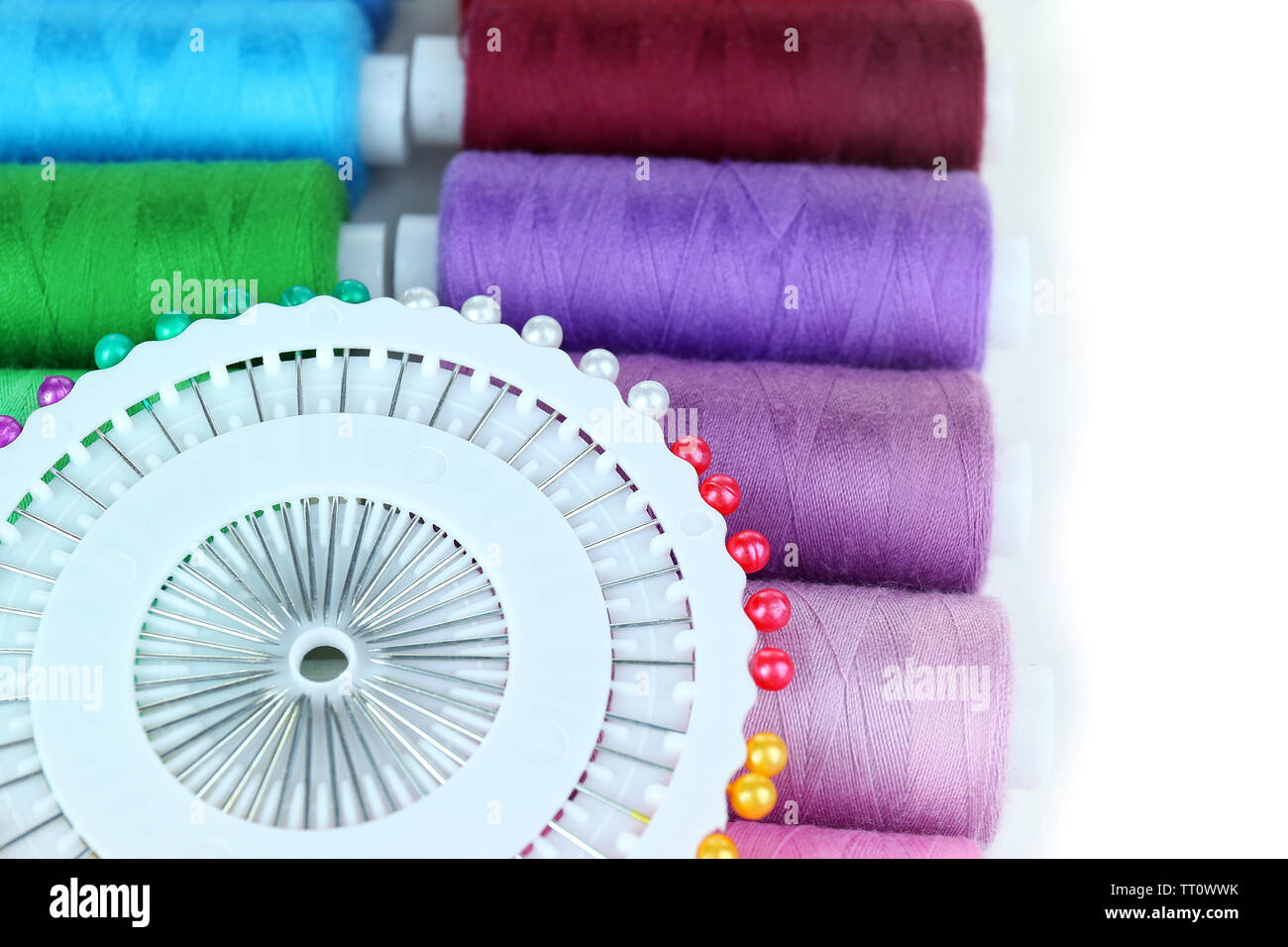 Colored spools of threads close up Stock Photo - Alamy