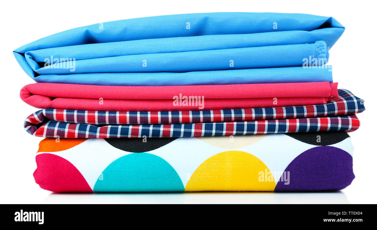 Pile of colored fabrics isolated on white Stock Photo - Alamy