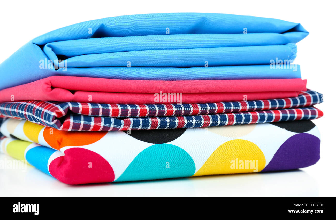 Pile of colored fabrics isolated on white Stock Photo - Alamy