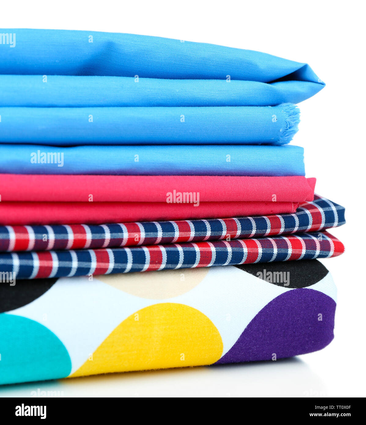 Pile of colored fabrics isolated on white Stock Photo - Alamy