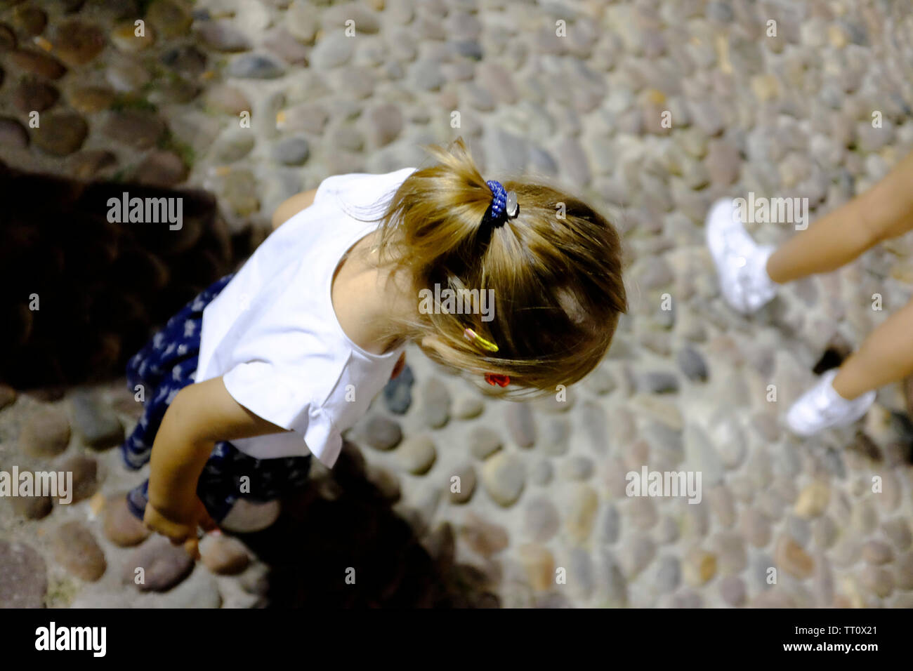 Caucasian little girl looking down Stock Photo - Alamy