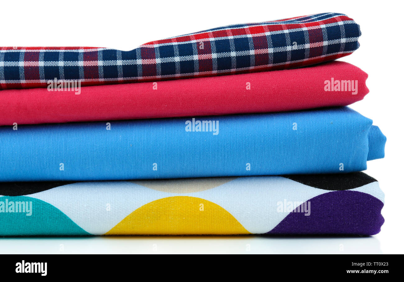 Pile of colored fabrics isolated on white Stock Photo - Alamy