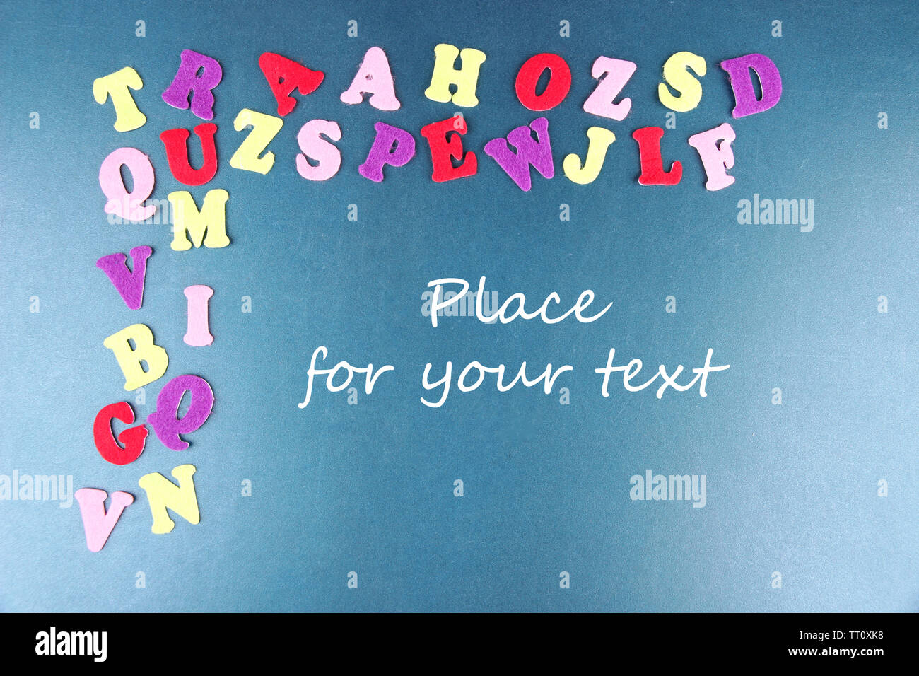 English alphabet on school desk background Stock Photo - Alamy