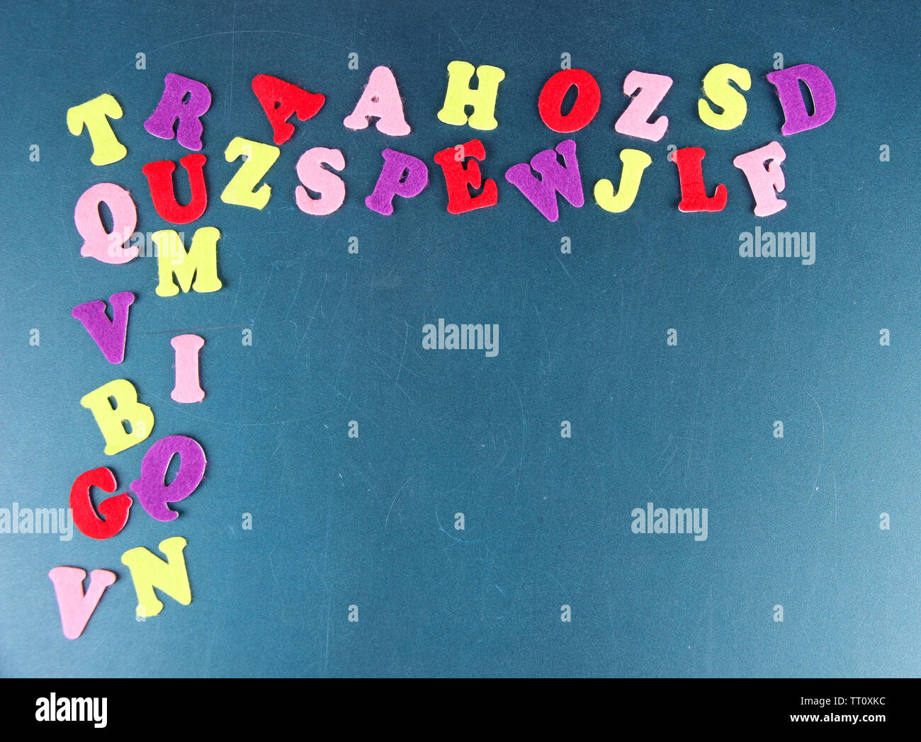 English alphabet on school desk background Stock Photo - Alamy