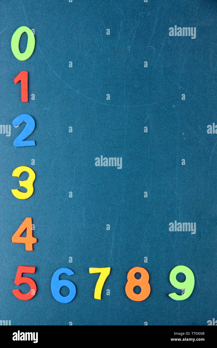 Colorful numbers on school desk background Stock Photo - Alamy