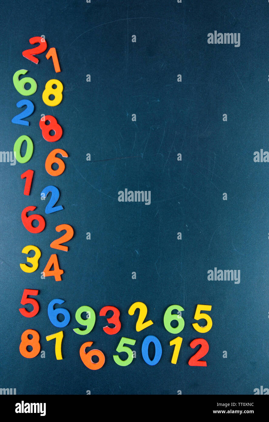 Colorful numbers on school desk background Stock Photo - Alamy