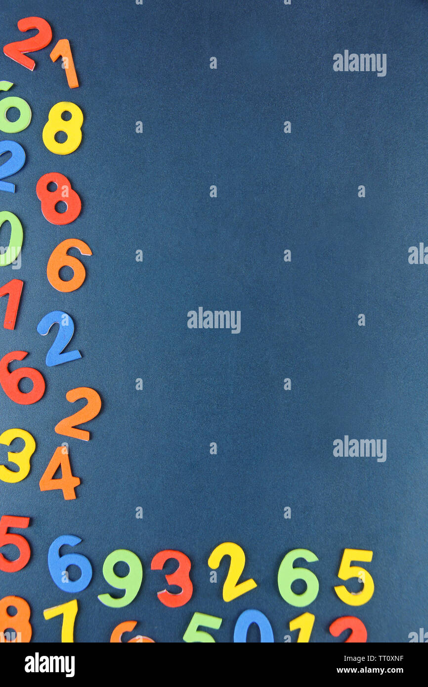 Colorful numbers on school desk background Stock Photo - Alamy