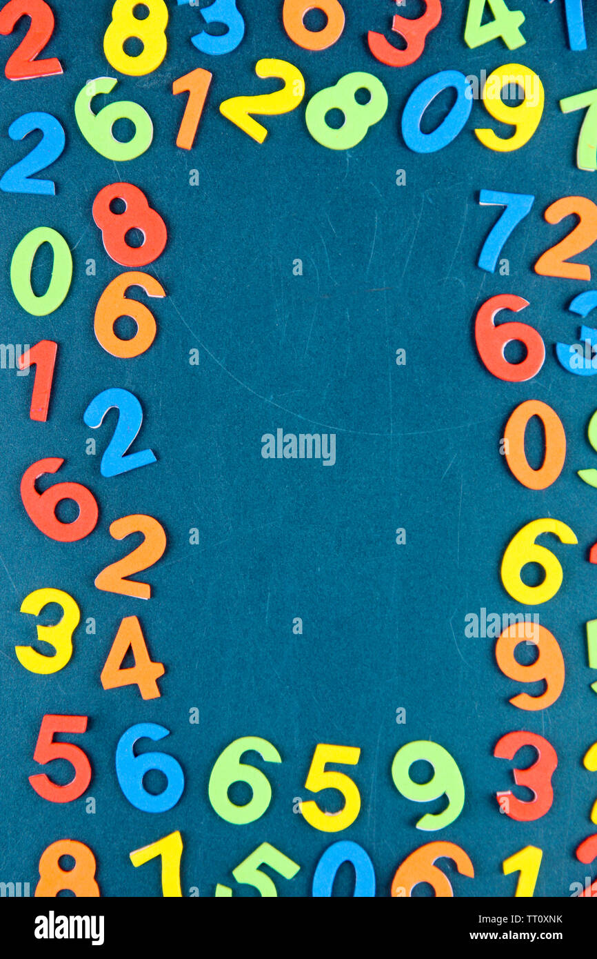 Colorful numbers on school desk background Stock Photo - Alamy