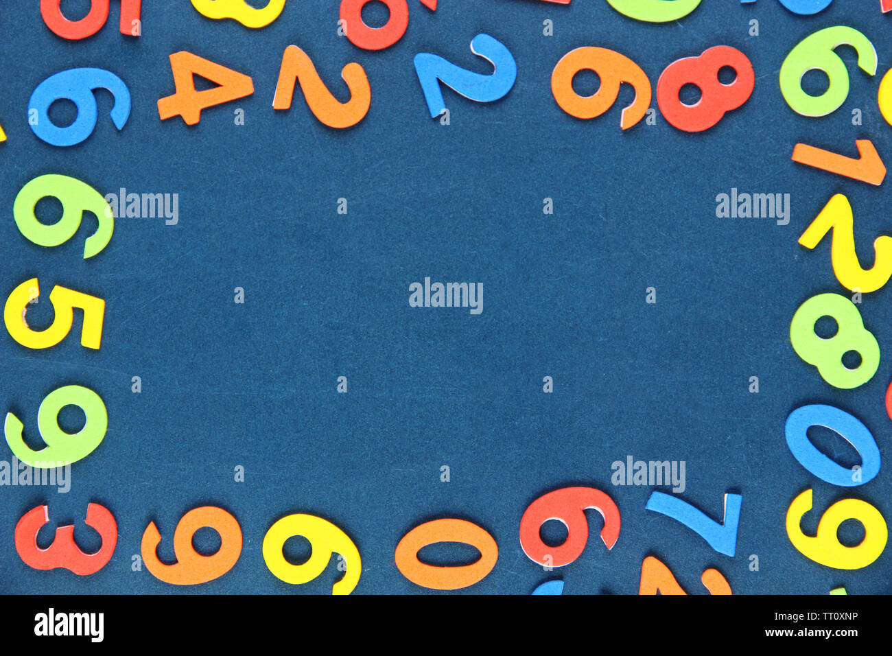 Colorful numbers on school desk background Stock Photo - Alamy