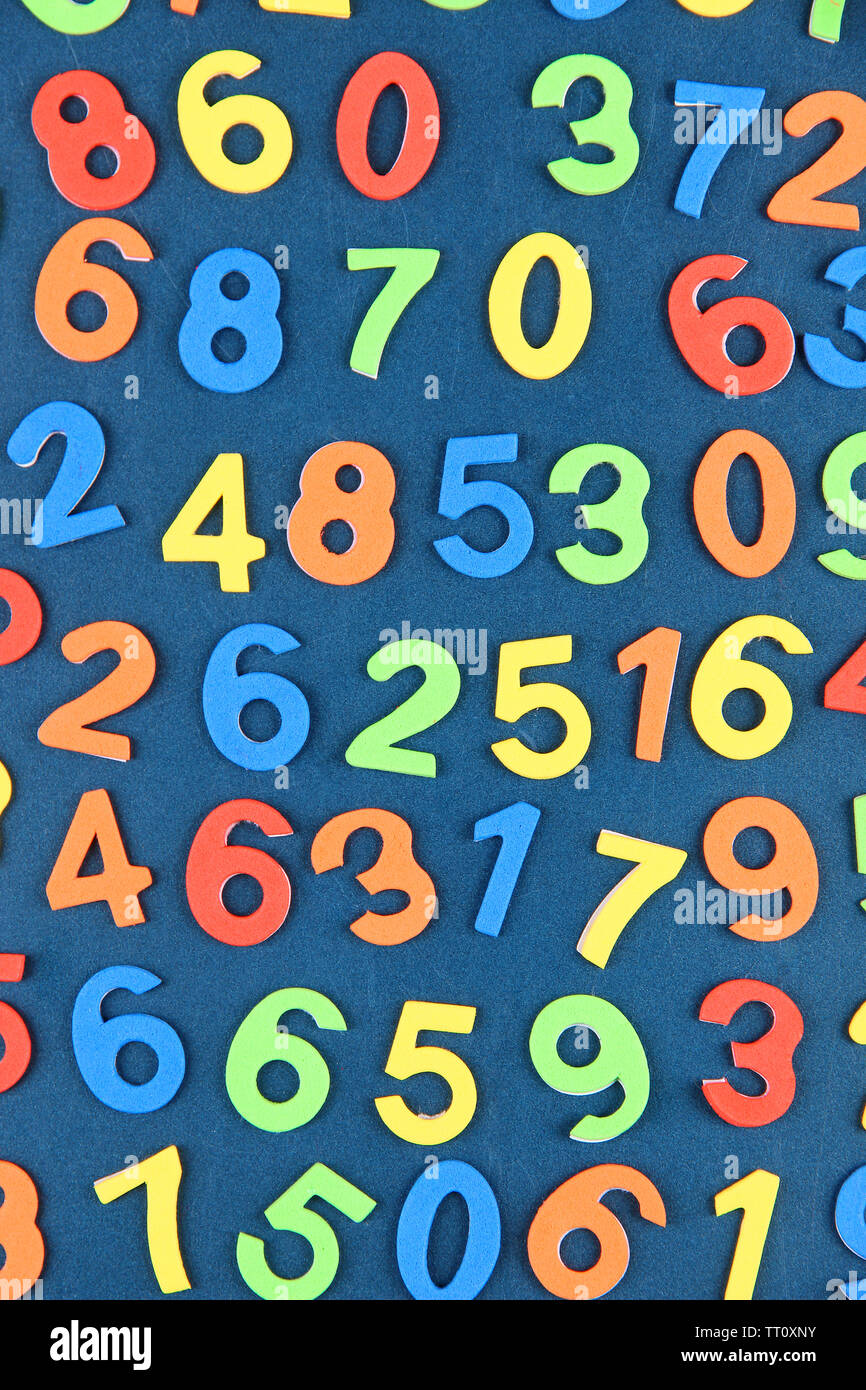 Colorful numbers on school desk background Stock Photo - Alamy