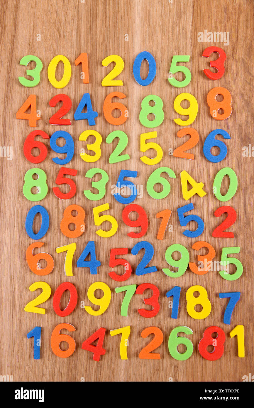 Colorful numbers on wooden background Stock Photo - Alamy