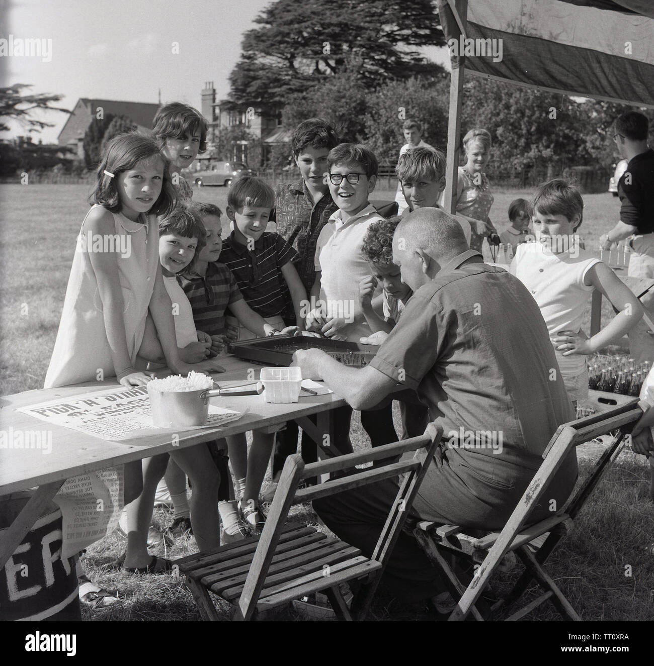 1965, historical, children at a fete playing a game of bagatelle ...