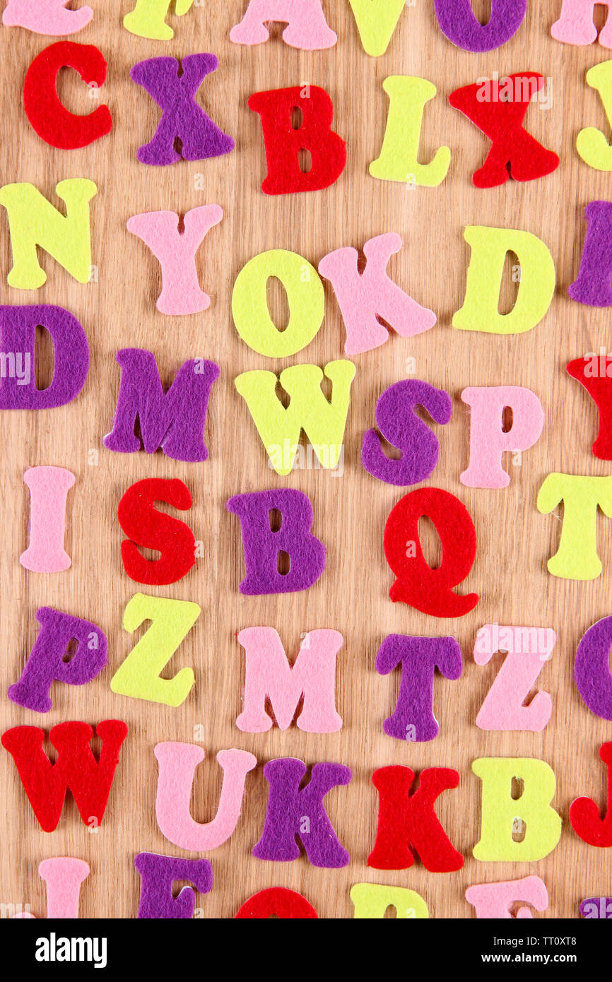 English alphabet on wooden background Stock Photo - Alamy