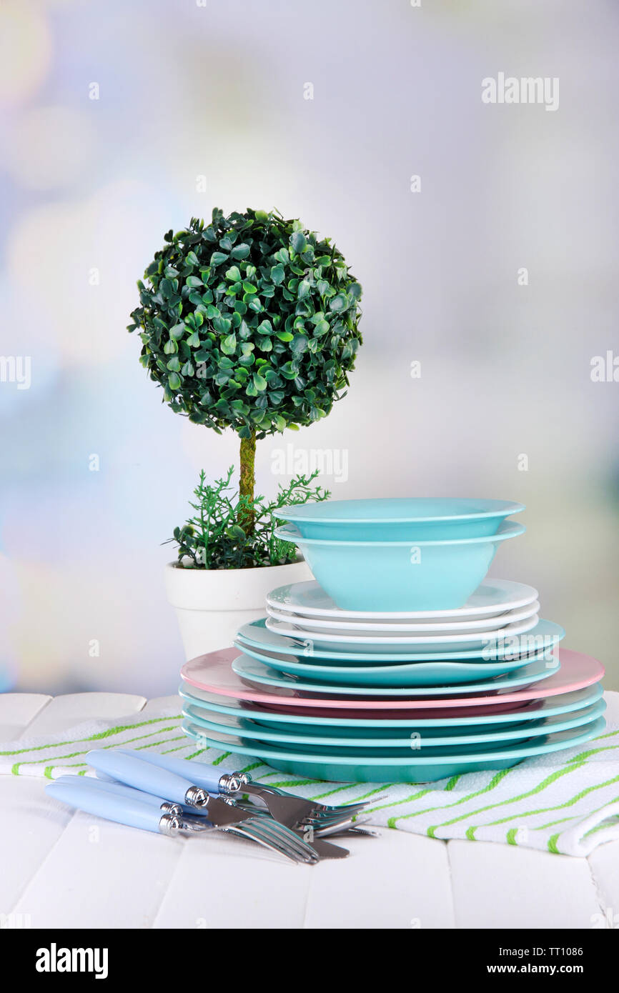 Clean dishes with flower on wooden table on natural background Stock ...
