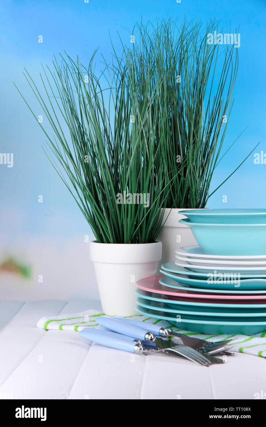 Clean dishes with flowers on wooden table on natural background Stock ...
