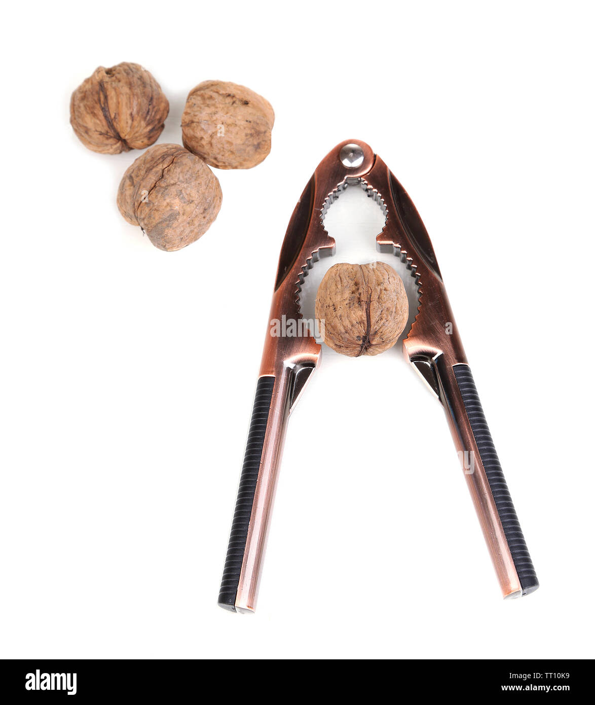 Nutcracker and walnuts isolated on white background Stock Photo - Alamy