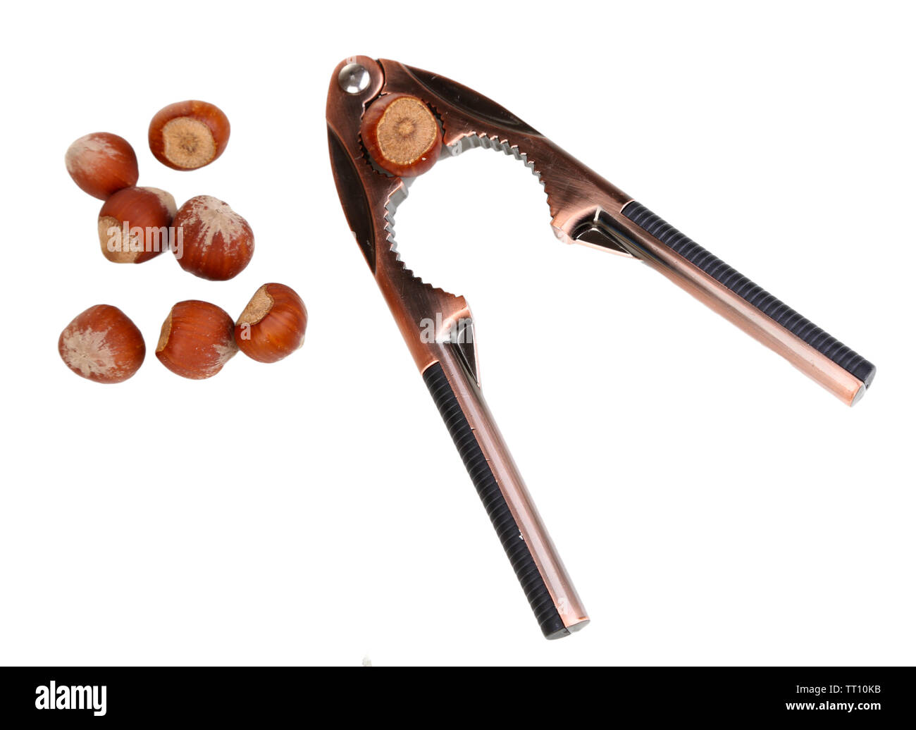 Nutcracker and hazelnuts isolated on white Stock Photo - Alamy
