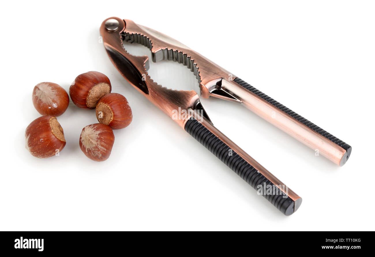 Nutcracker and hazelnuts isolated on white Stock Photo - Alamy
