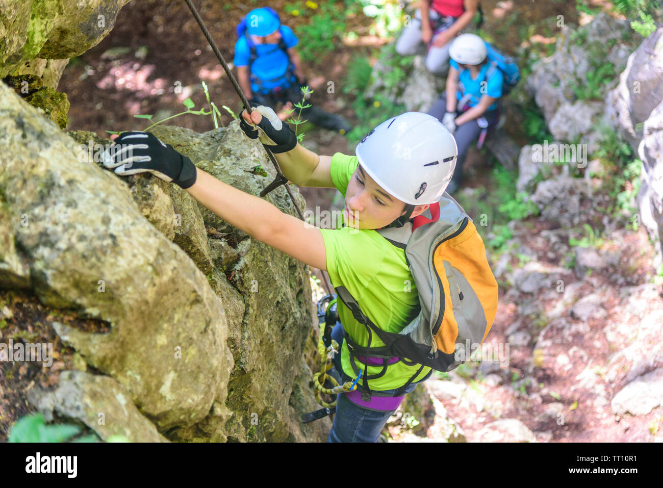 Hiking and climbing on a forestry and rocky trail with via ferrata ...