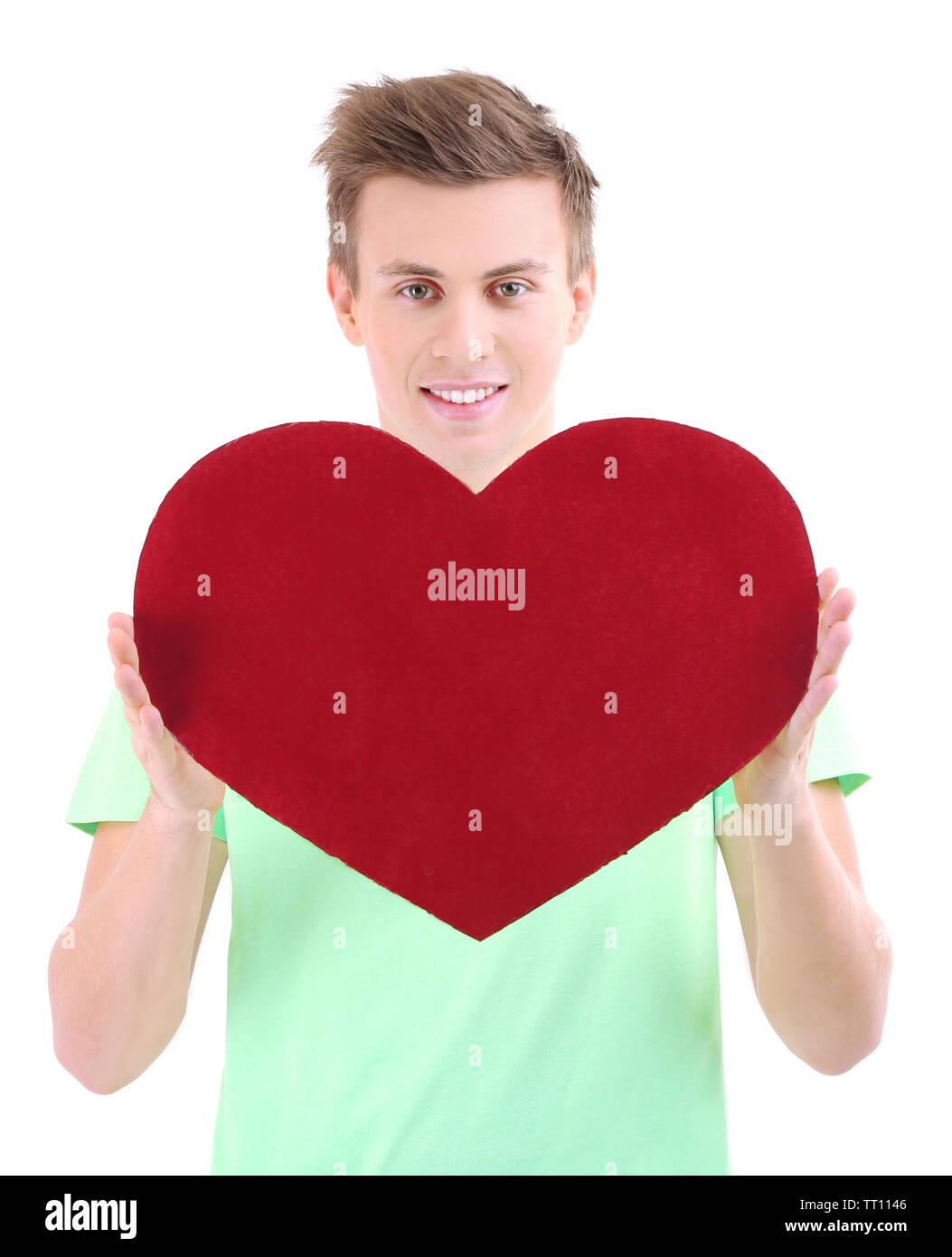 Handsome young man with big red heart, isolated on white Stock Photo ...