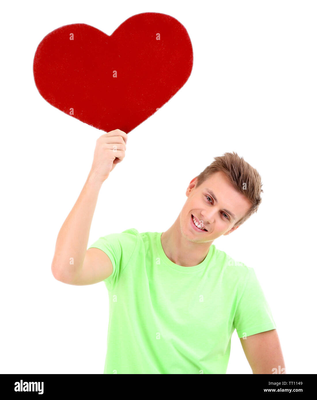 Handsome young man with big red heart, isolated on white Stock Photo ...