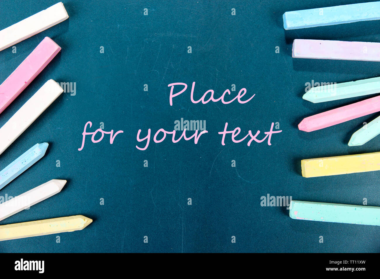 Colorful chalks on school desk Stock Photo - Alamy