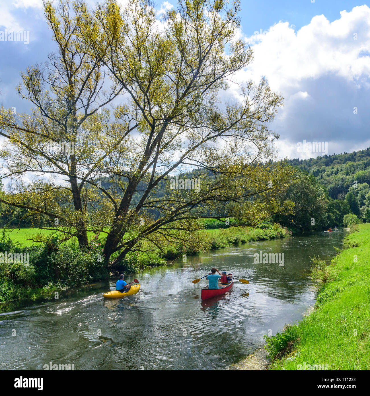 Group of people doing canoe tour on idyllic river in franconia Stock ...