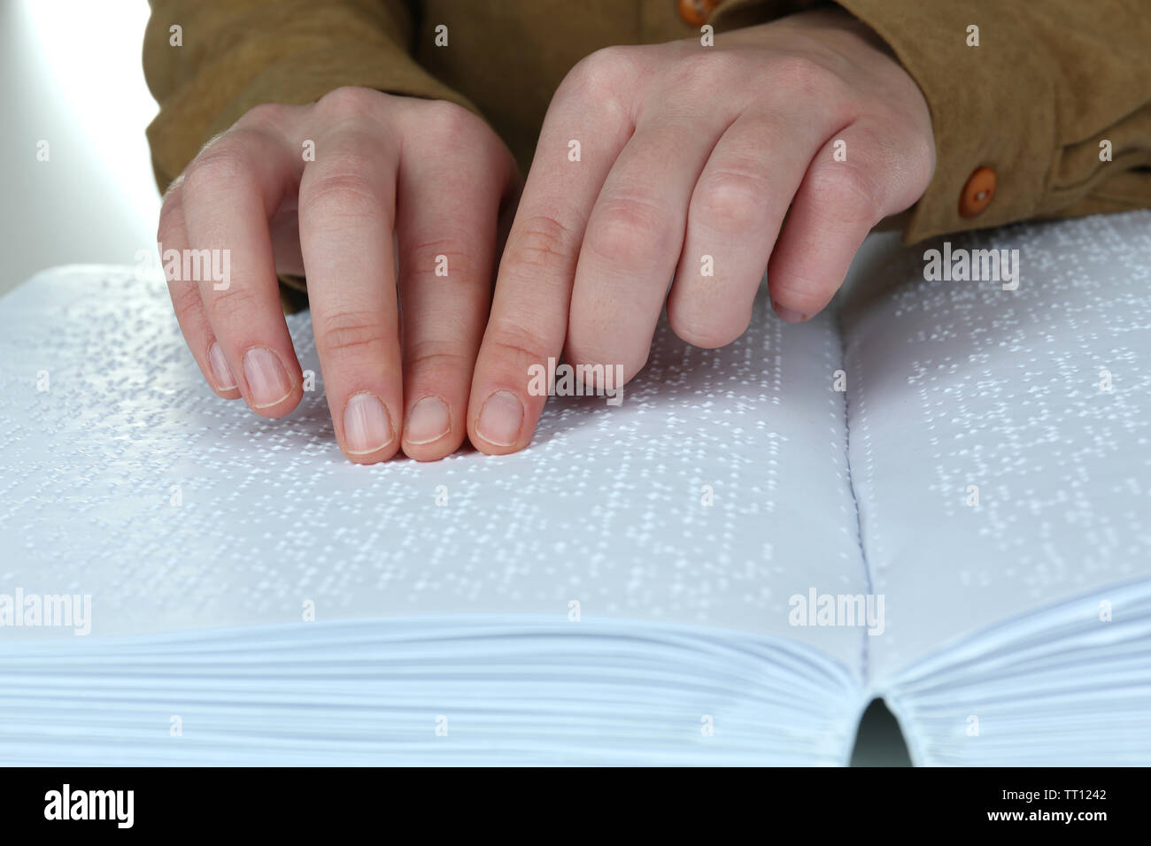 Blind woman read book written in Braille Stock Photo - Alamy