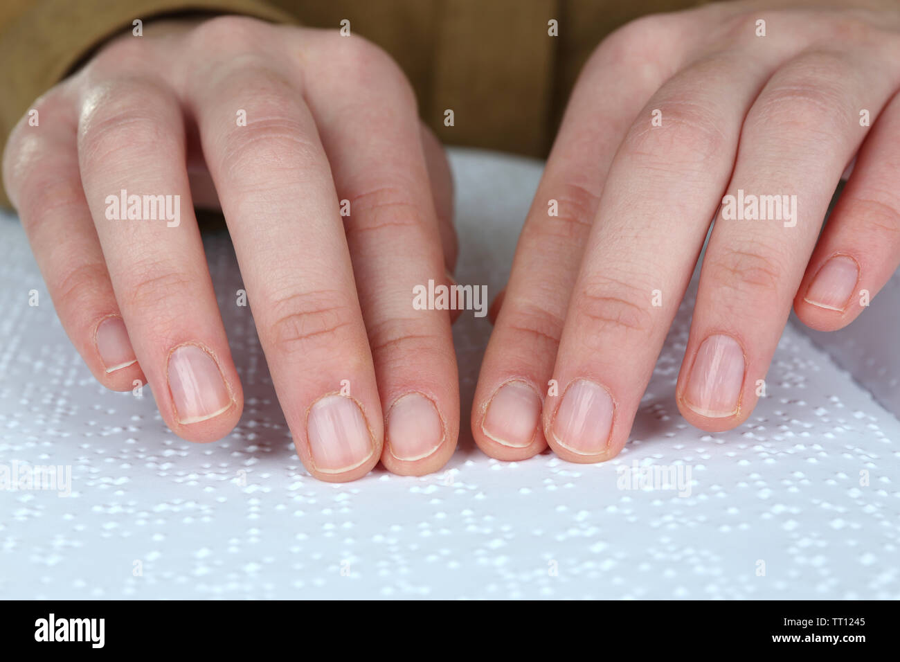 Blind woman read book written in Braille Stock Photo - Alamy