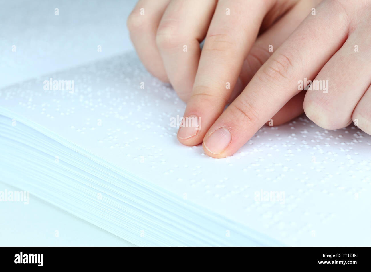 Blind woman read book written in Braille Stock Photo - Alamy