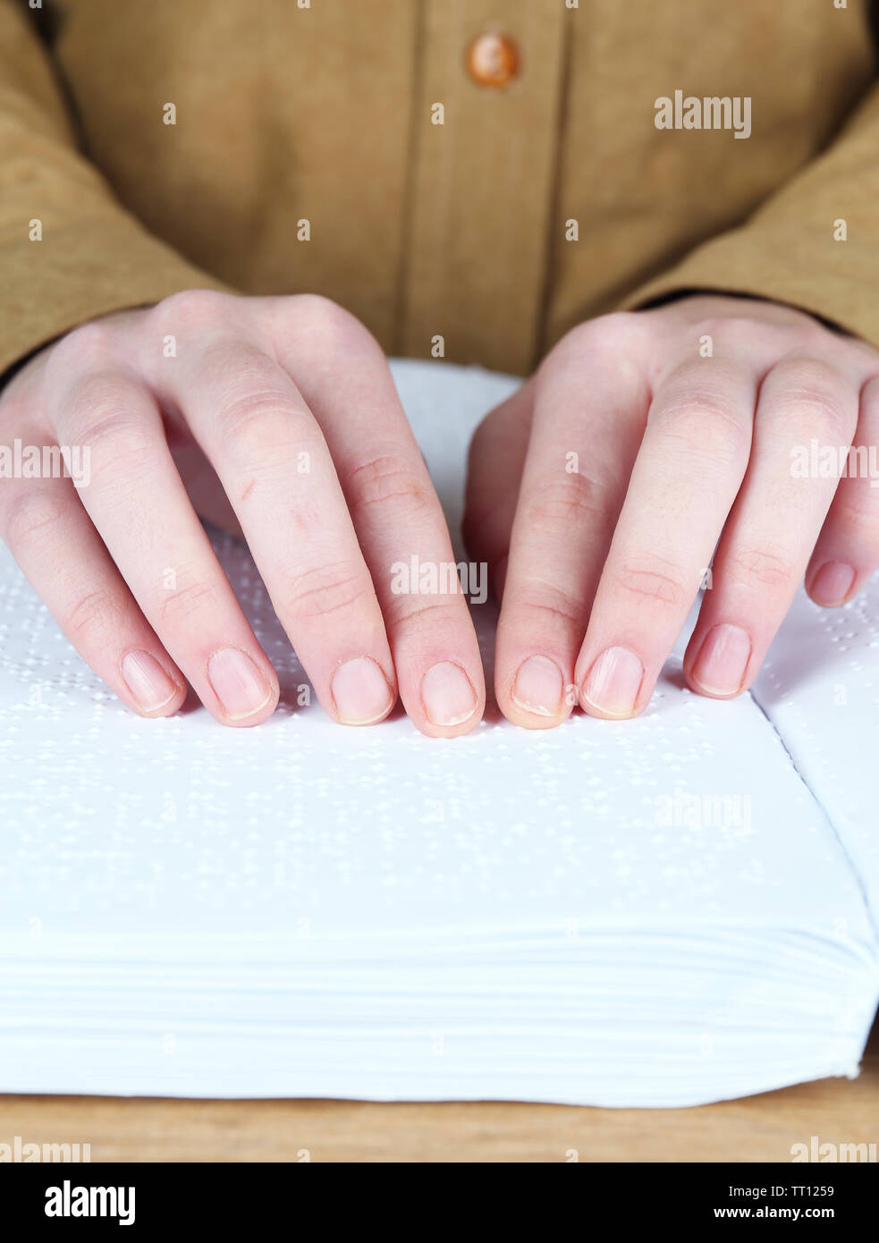 Blind woman read book written in Braille Stock Photo - Alamy