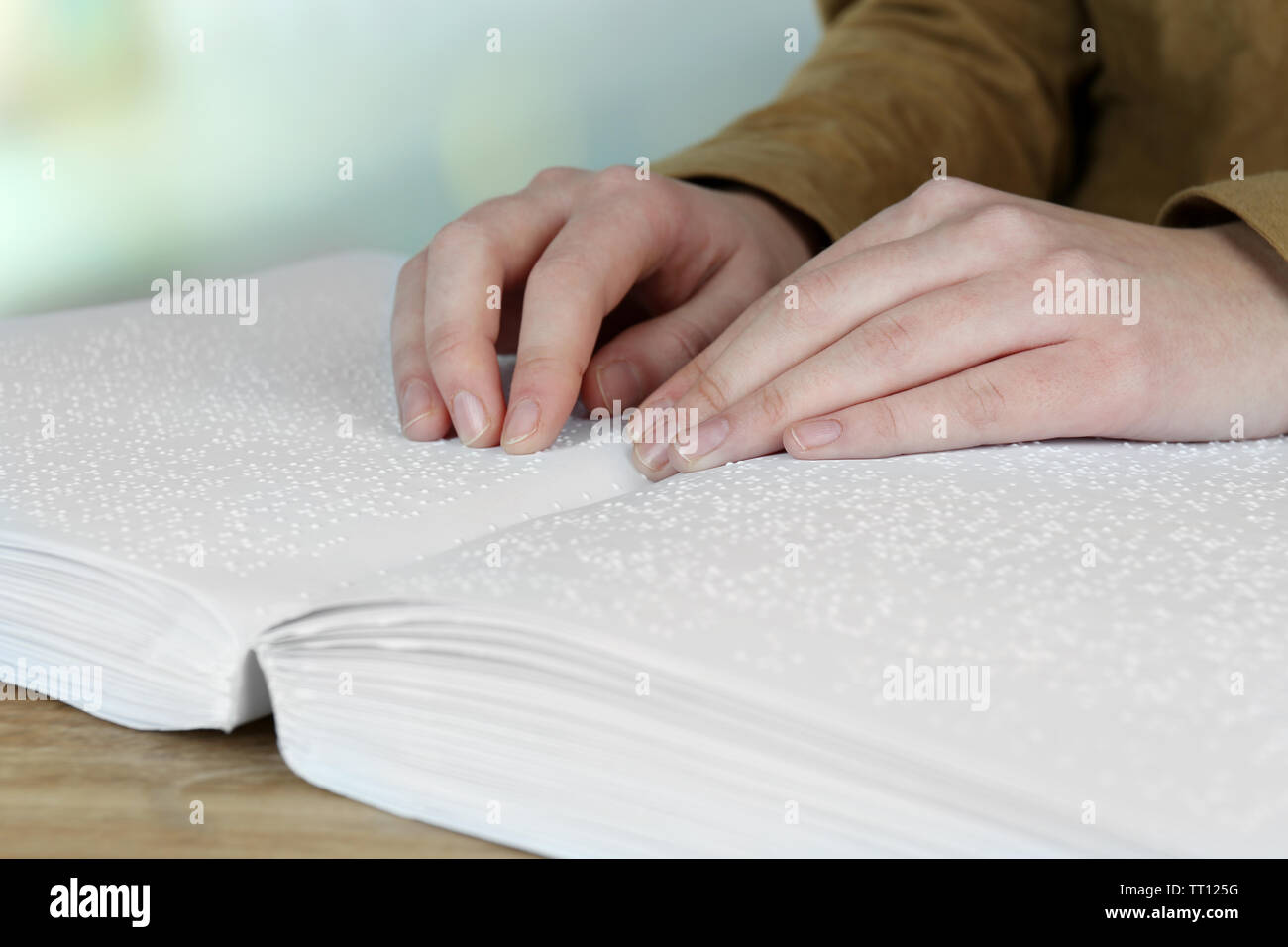 Blind woman read book written in Braille Stock Photo - Alamy