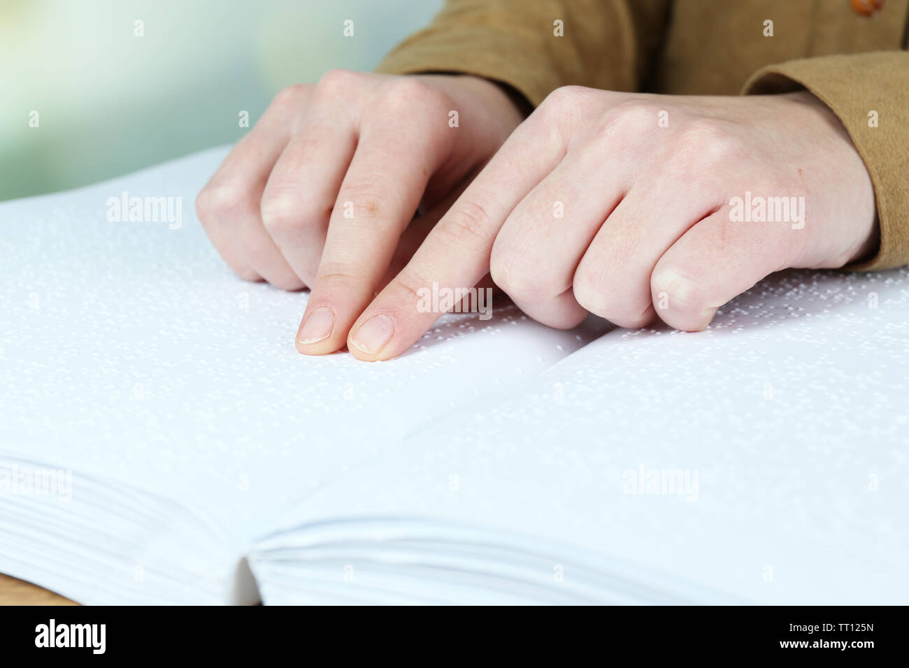 Blind woman read book written in Braille Stock Photo - Alamy