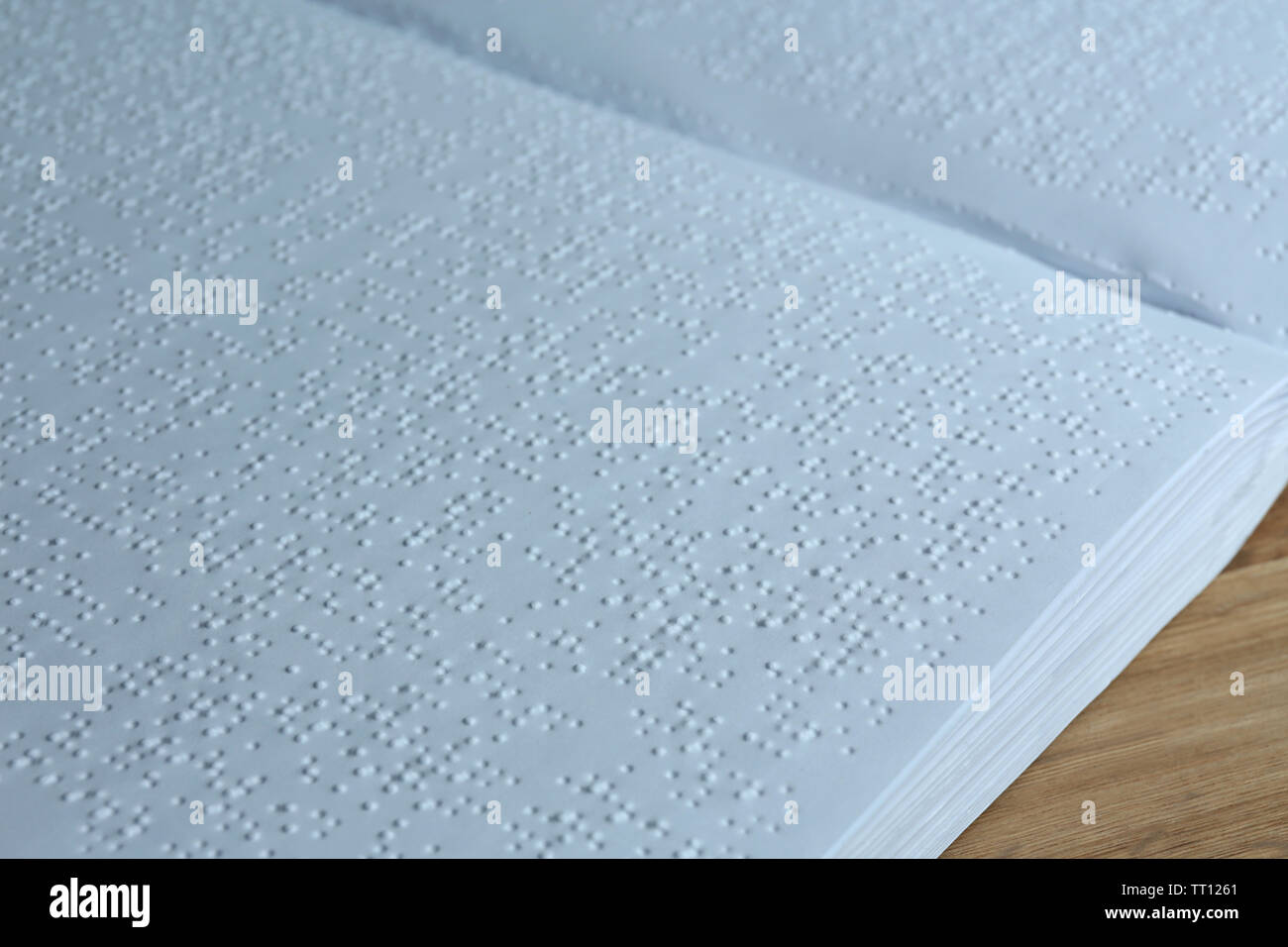 Book written in braille alphabet for blind people Stock Photo - Alamy