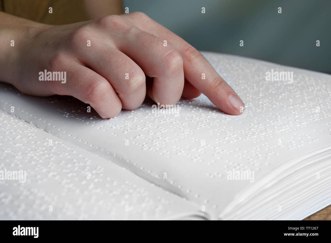 Blind woman read book written in Braille Stock Photo - Alamy