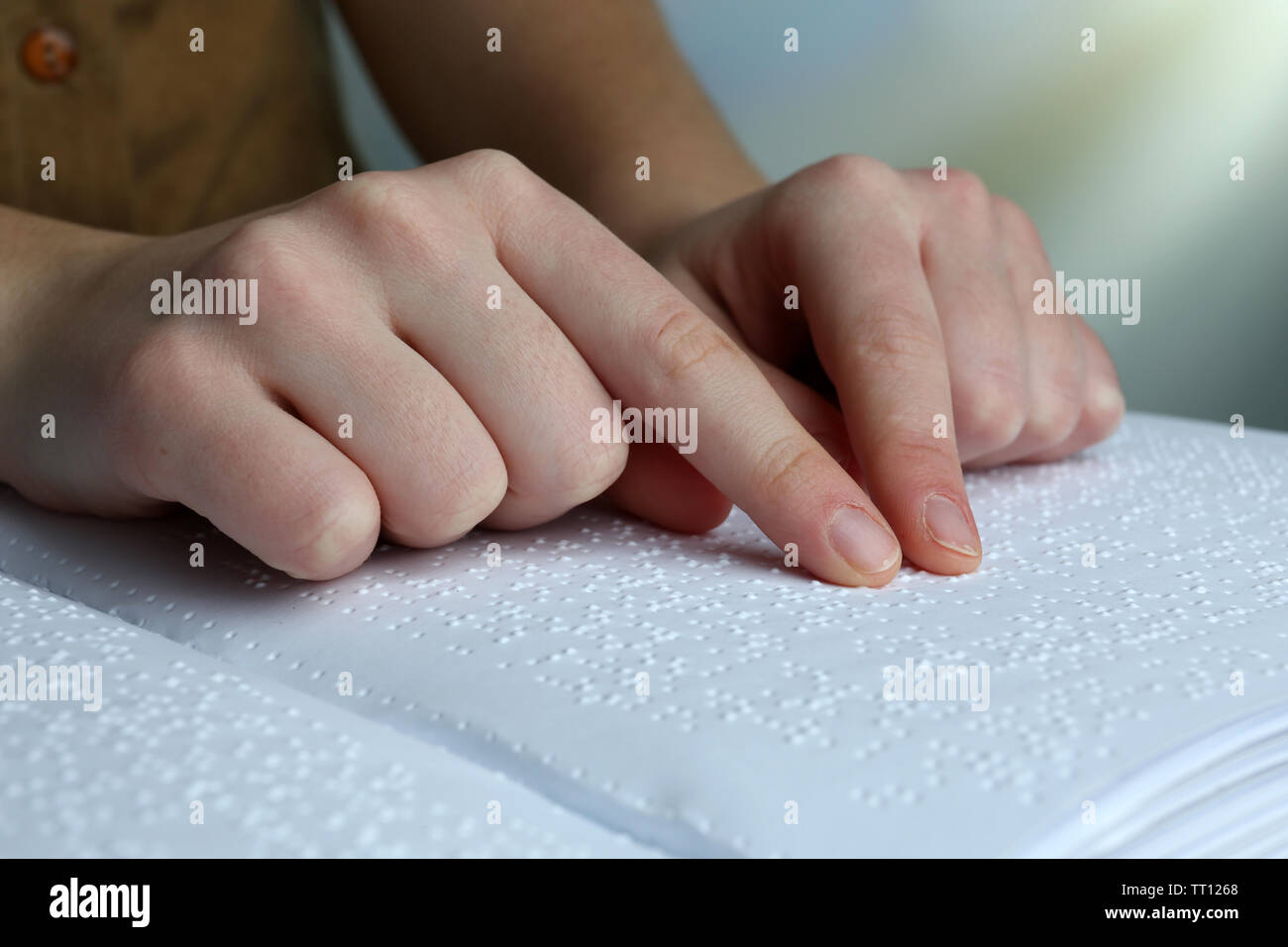 Blind woman read book written in Braille Stock Photo - Alamy