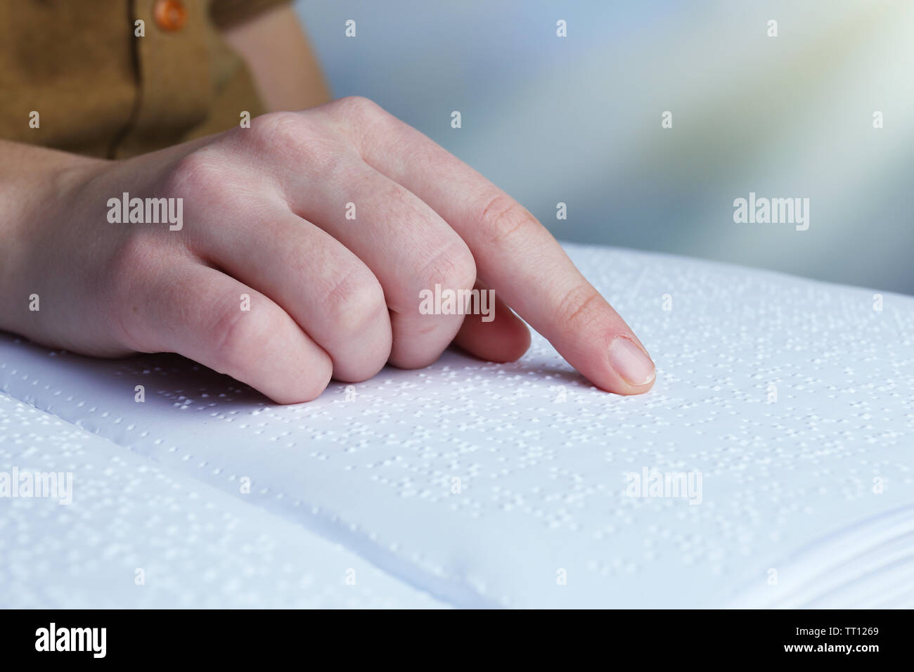 Blind woman read book written in Braille Stock Photo - Alamy