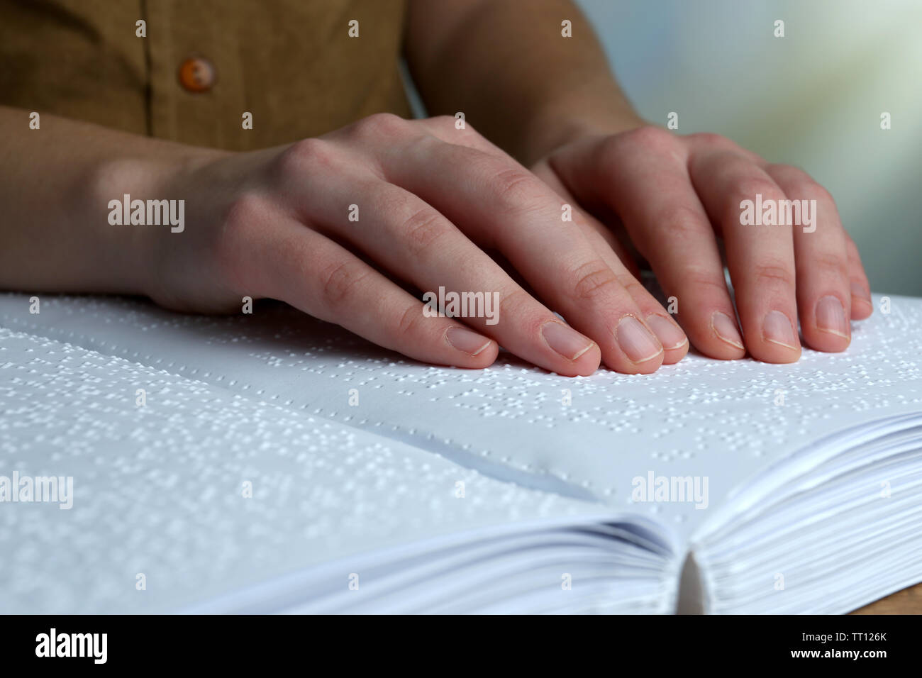 Blind woman read book written in Braille Stock Photo - Alamy