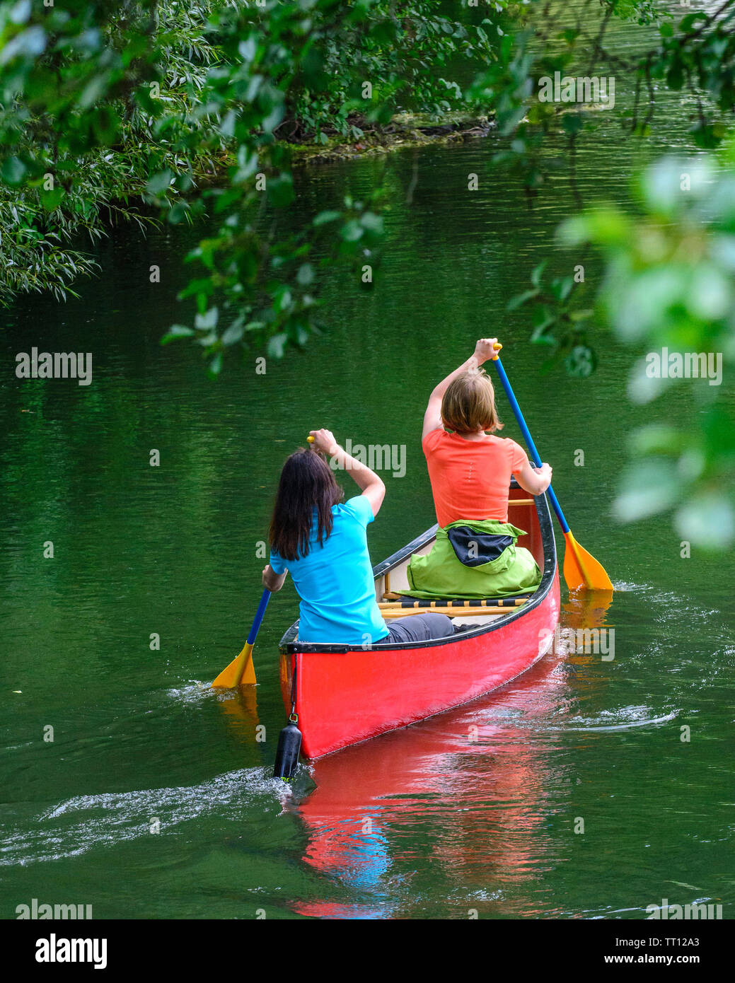Two women navigating canoe on river in bavaria Stock Photo - Alamy