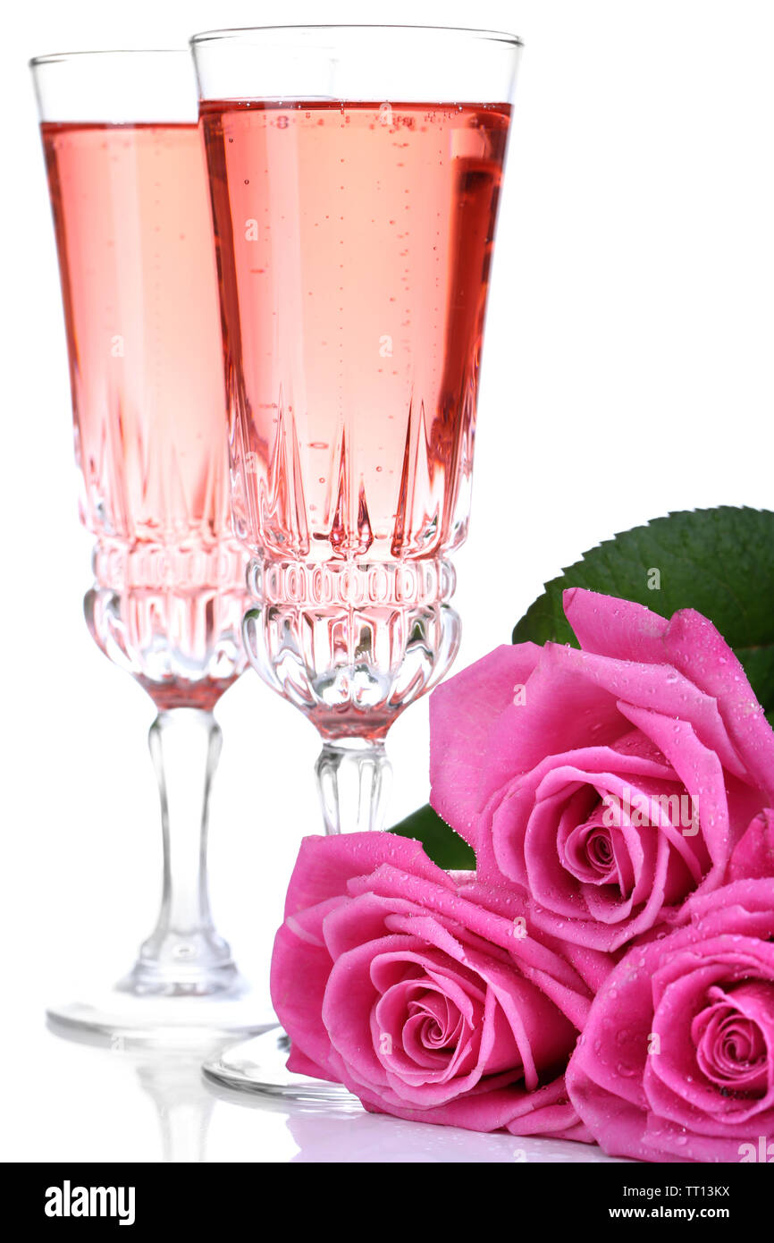 Composition with pink sparkle wine in glasses and pink roses isolated ...