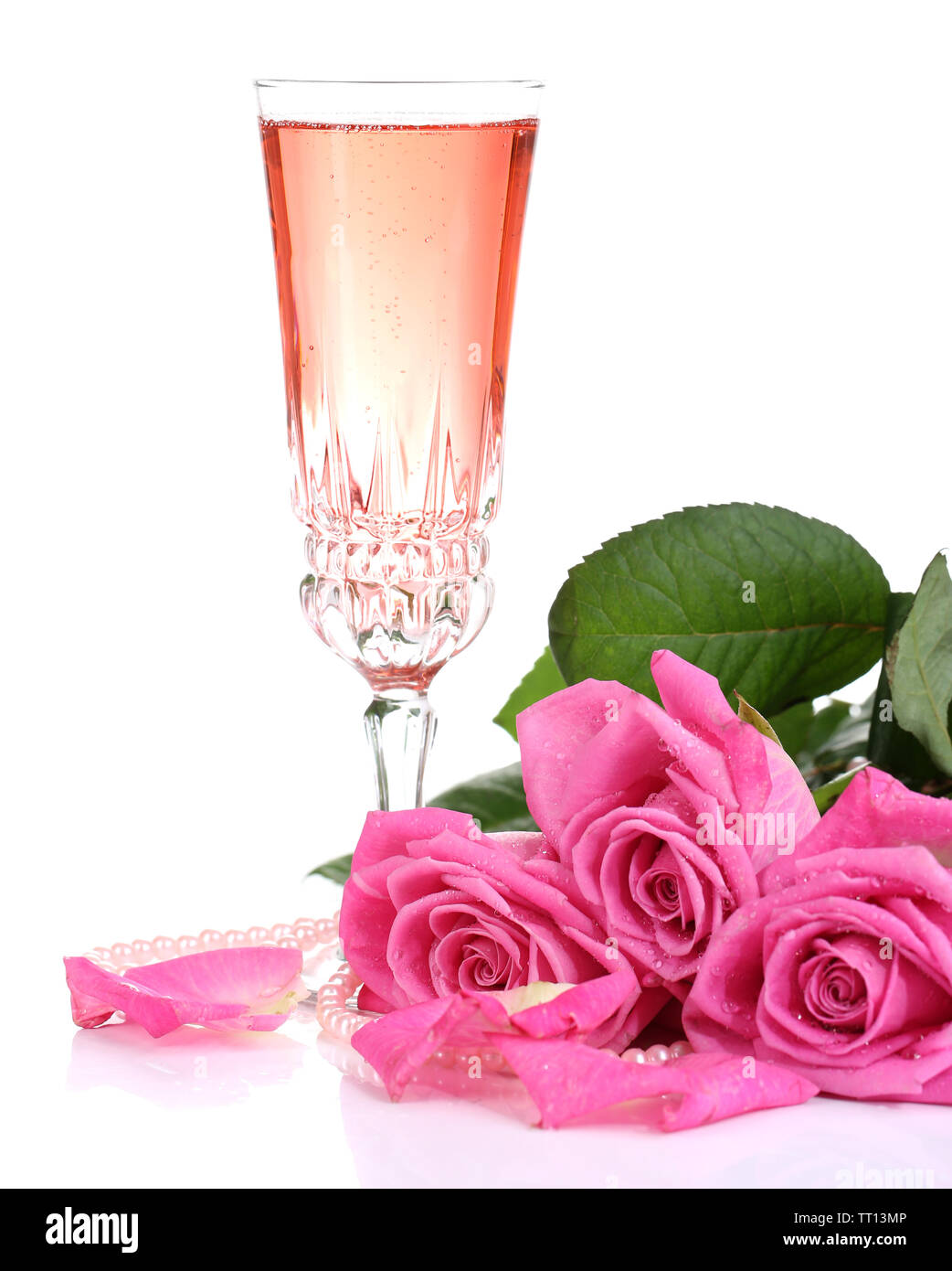Composition with pink sparkle wine in glass and pink roses isolated on ...