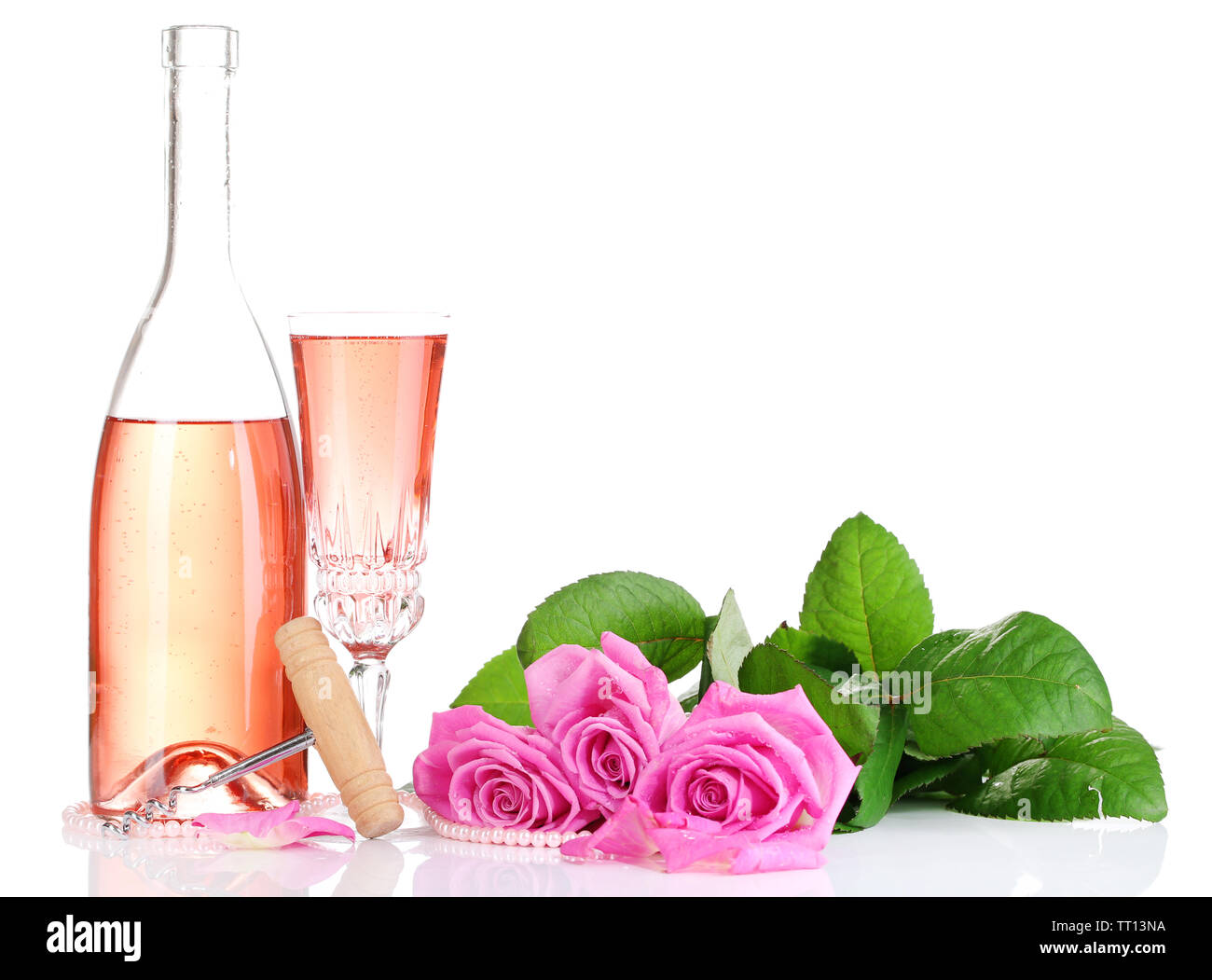 Composition with pink sparkle wine in glass, bottle and pink roses ...