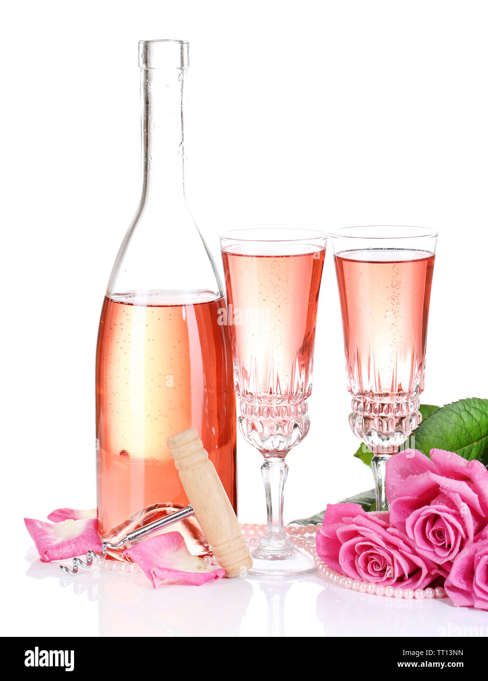 Composition with pink sparkle wine in glasses, bottle and pink roses ...